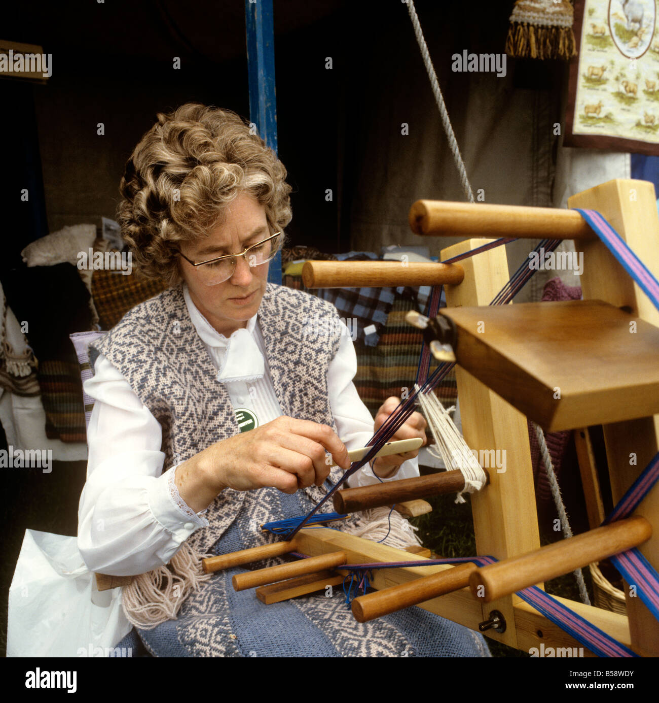 Craftswoman demonstrating weaving at crafts fair Stock Photo - Alamy