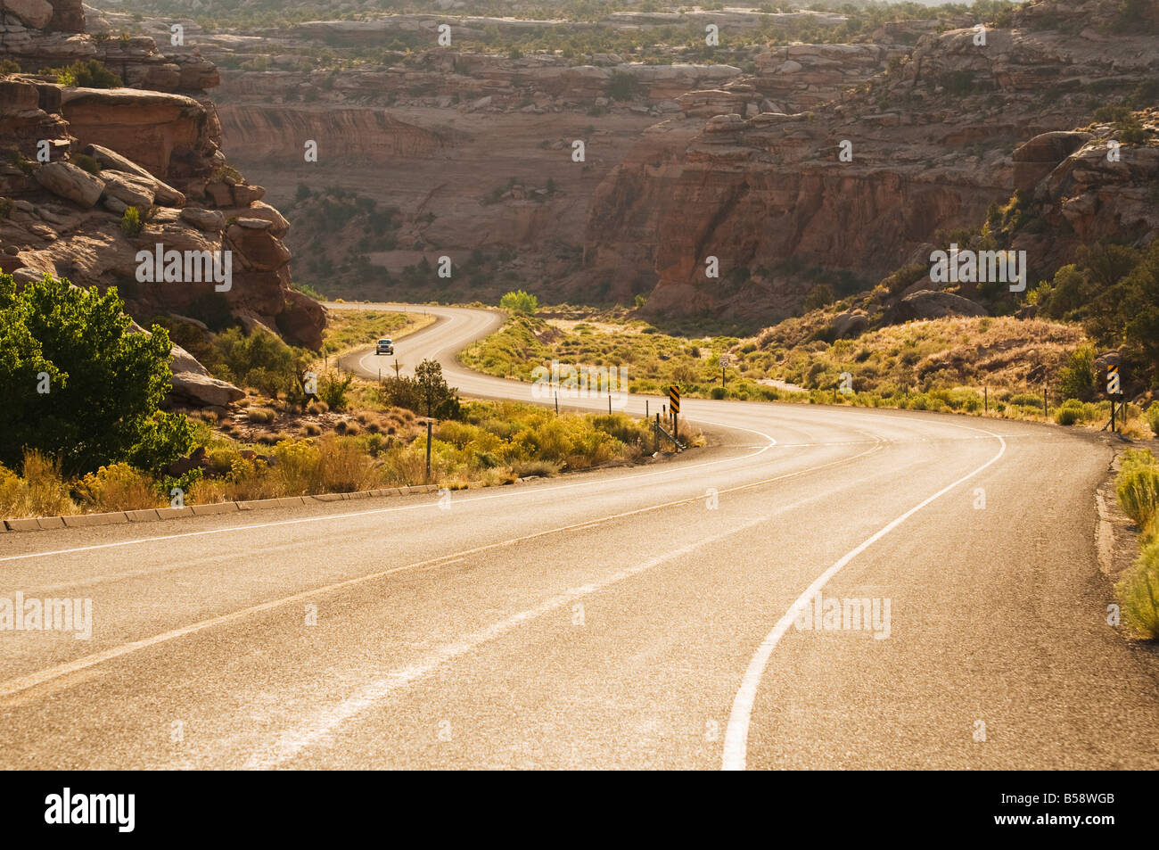 Western road at sunset Stock Photo - Alamy