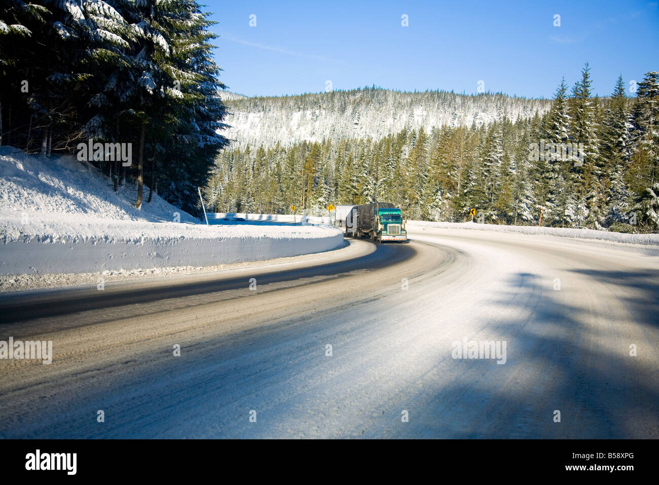 Semi truck driving on a winter road Stock Photo - Alamy