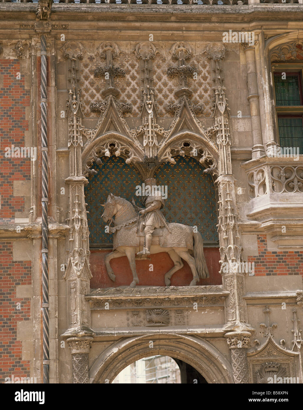 Statue of Louis XII on horseback above the chateau entrance at Blois ...