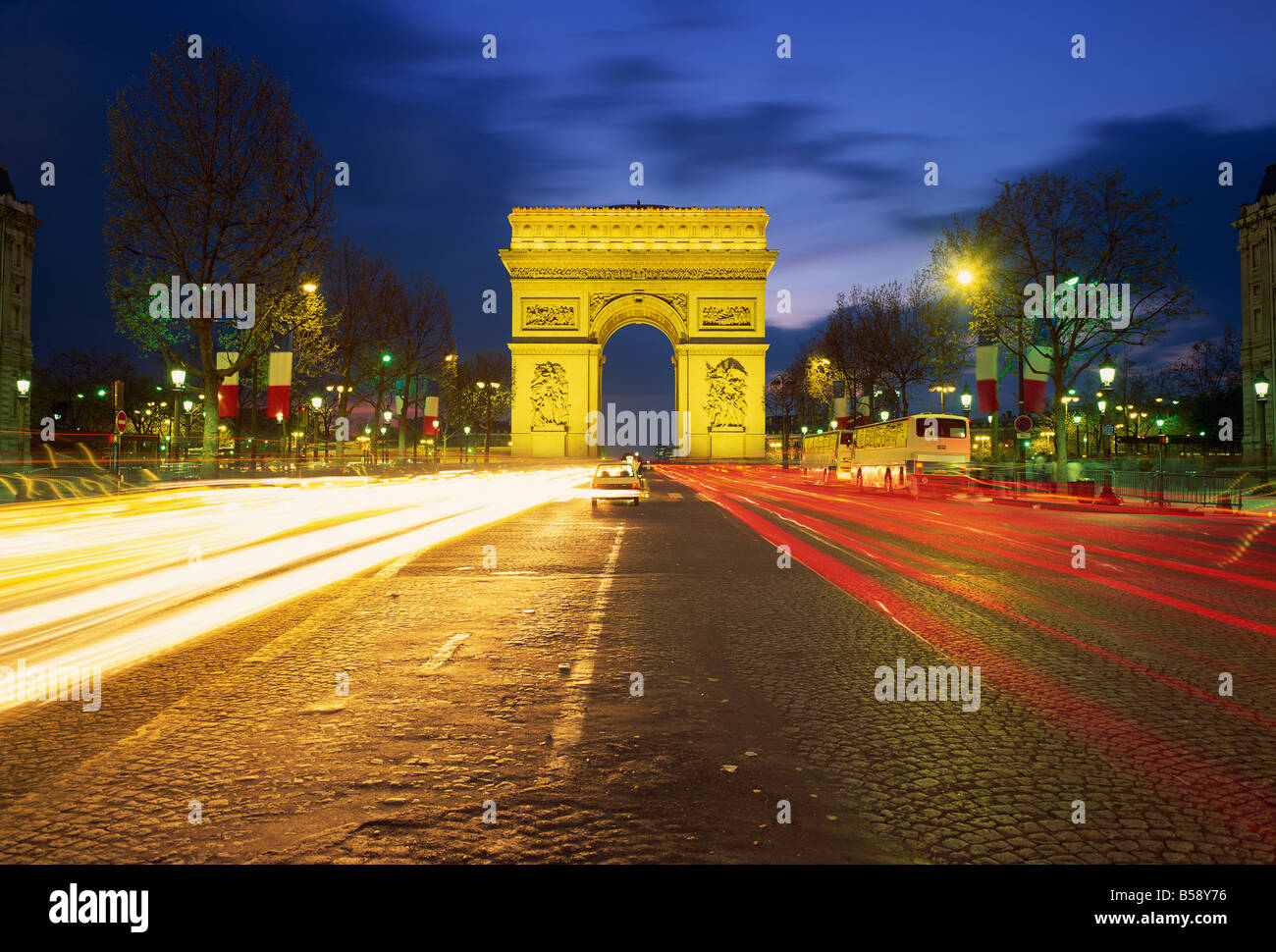 The Arc de Triomphe illuminated at dusk Paris France R Rainford Stock ...