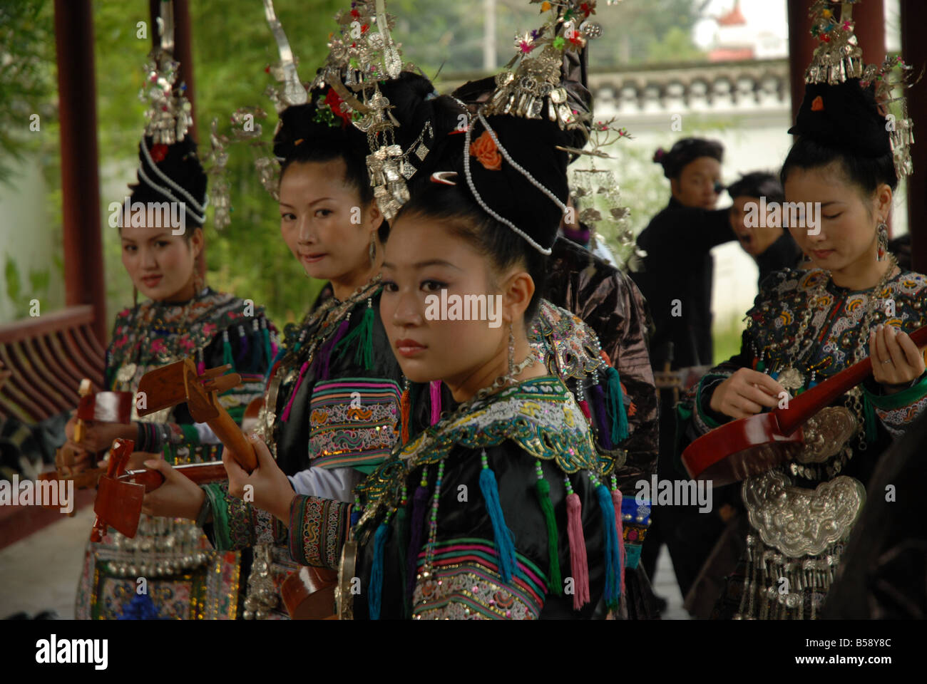 Women prepare to perform traditional music. They are members of the ...