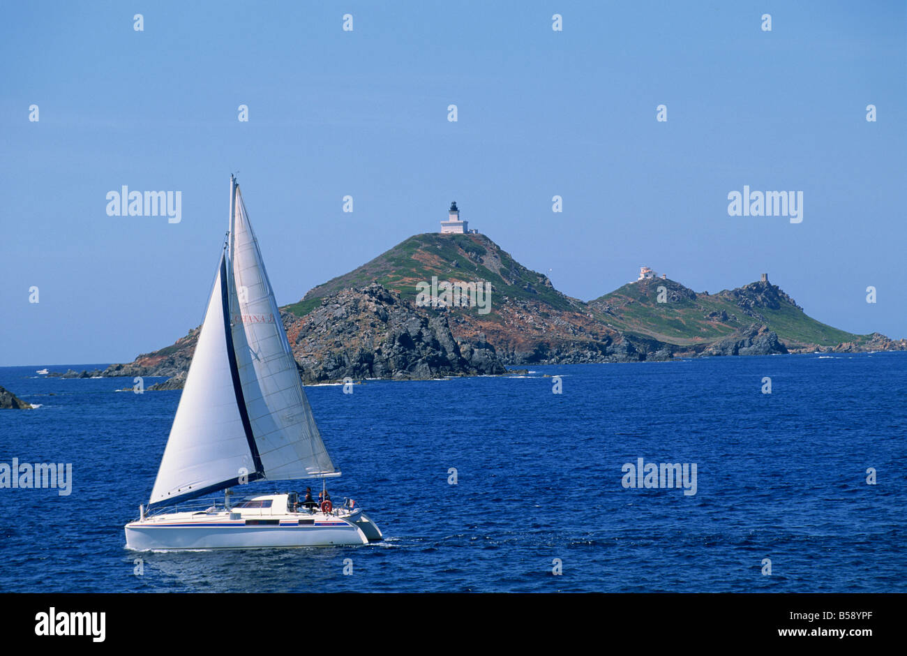 Sailing boat with the Semaphore Lighthouse behind Iles Sanguinaires ...