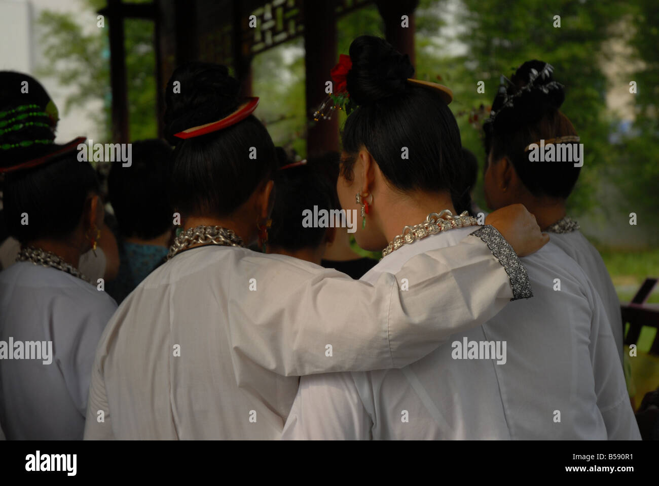 Women prepare to perform traditional music. They are members of the ...