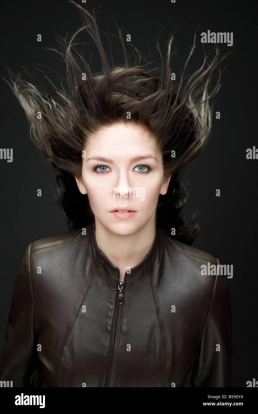 Woman with wind blown hair Stock Photo - Alamy