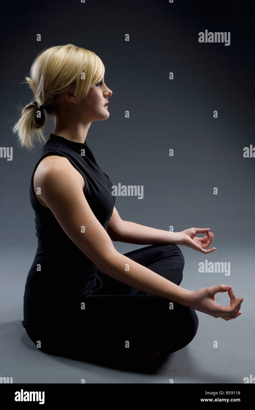 Healthy woman meditating in pose hi-res stock photography and images ...
