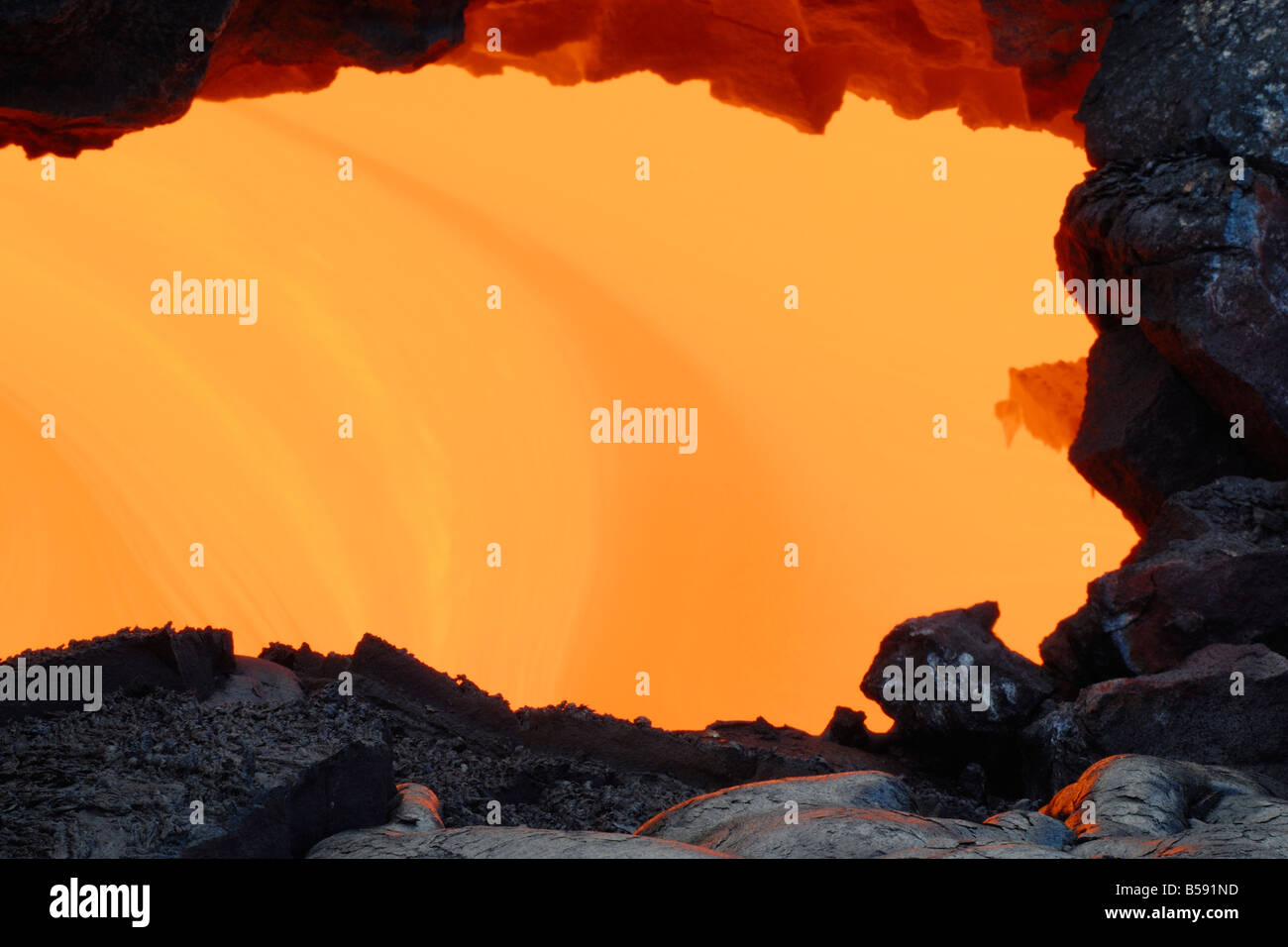 Skylight and flowing lava Waikupanaha ocean entry lava flow Stock Photo ...