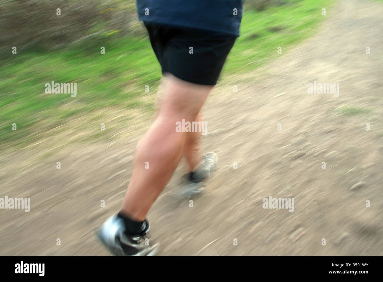 fast overweight man runner on country lane Stock Photo - Alamy