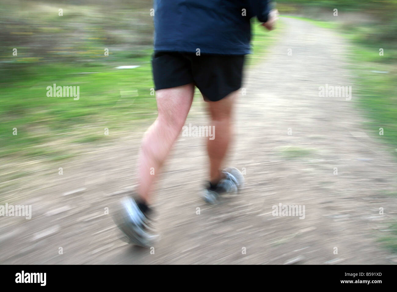 fast overweight man runner on country lane Stock Photo - Alamy