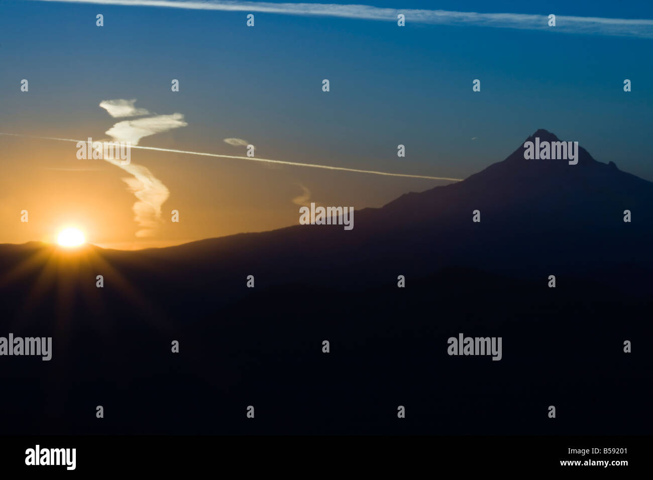 Sun rising behind Mt Hood in Oregon Stock Photo - Alamy