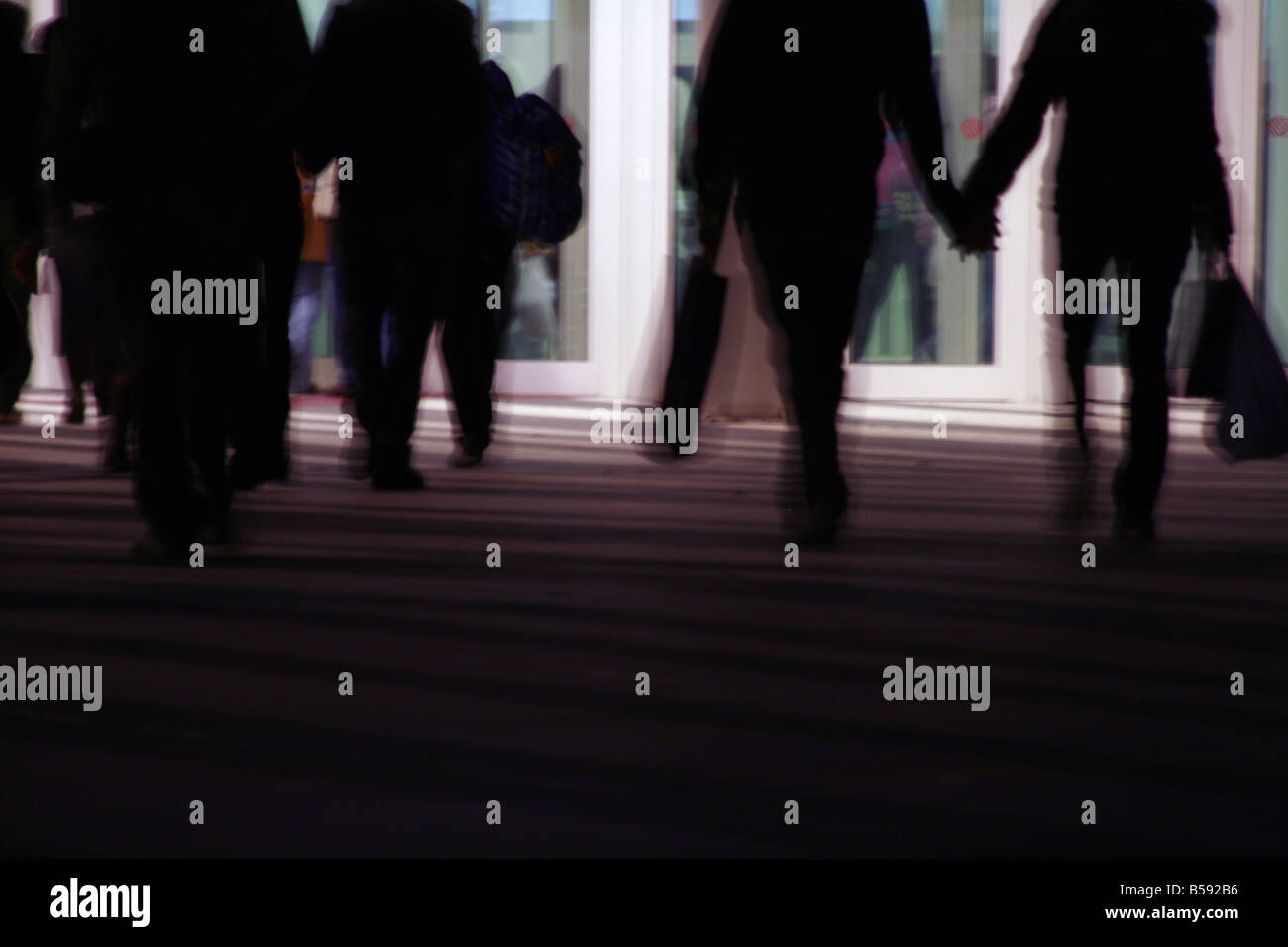 crowd of people walking in street at night Stock Photo - Alamy
