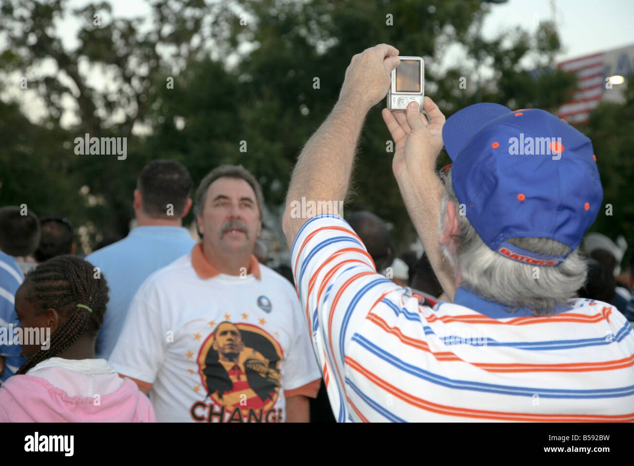 Obama supporter having his picture taken in front of the crowds at the ...