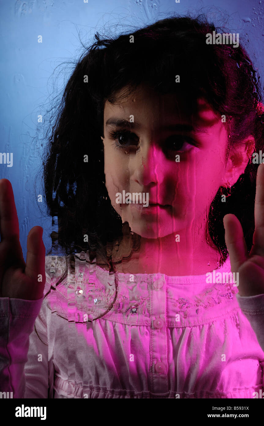 Child behind window in rain Stock Photo - Alamy