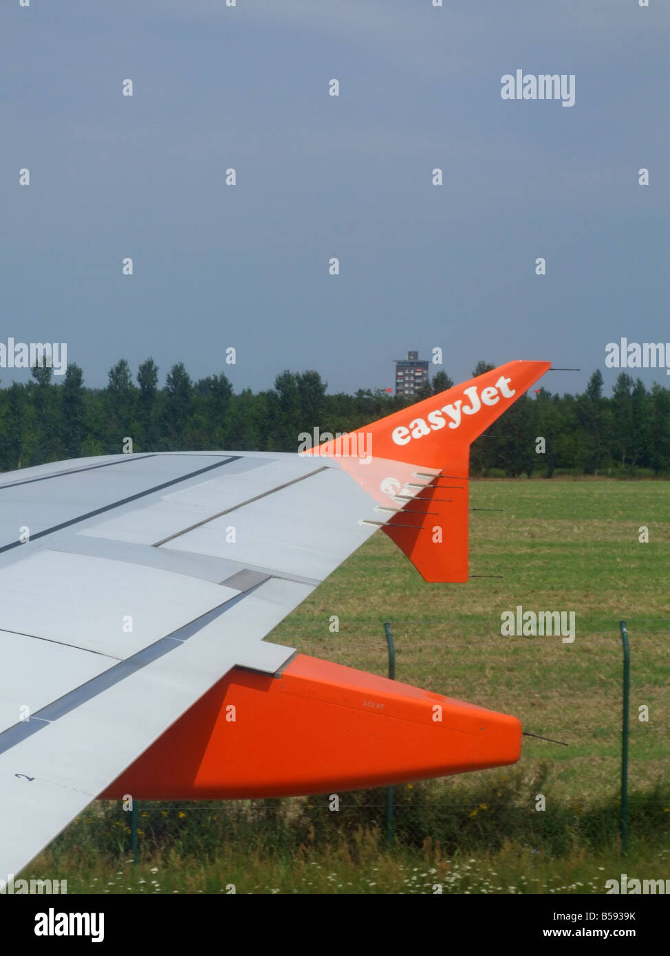 easyjet plane on runway at airport in sun Stock Photo - Alamy