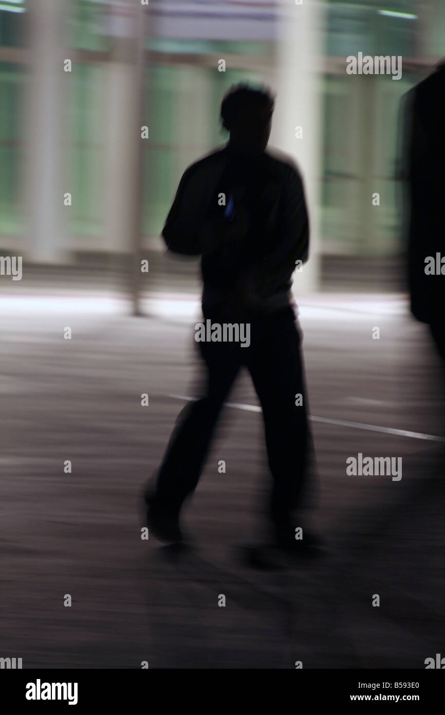 one person walking in street at night Stock Photo - Alamy