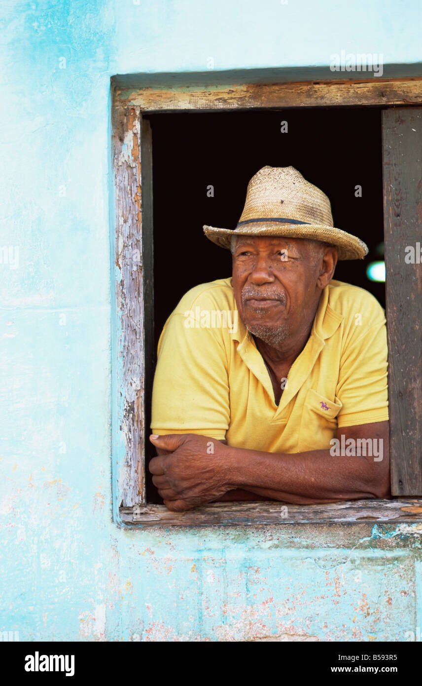 Man leaning out of the window of his house Trinidad Cuba West Indies ...