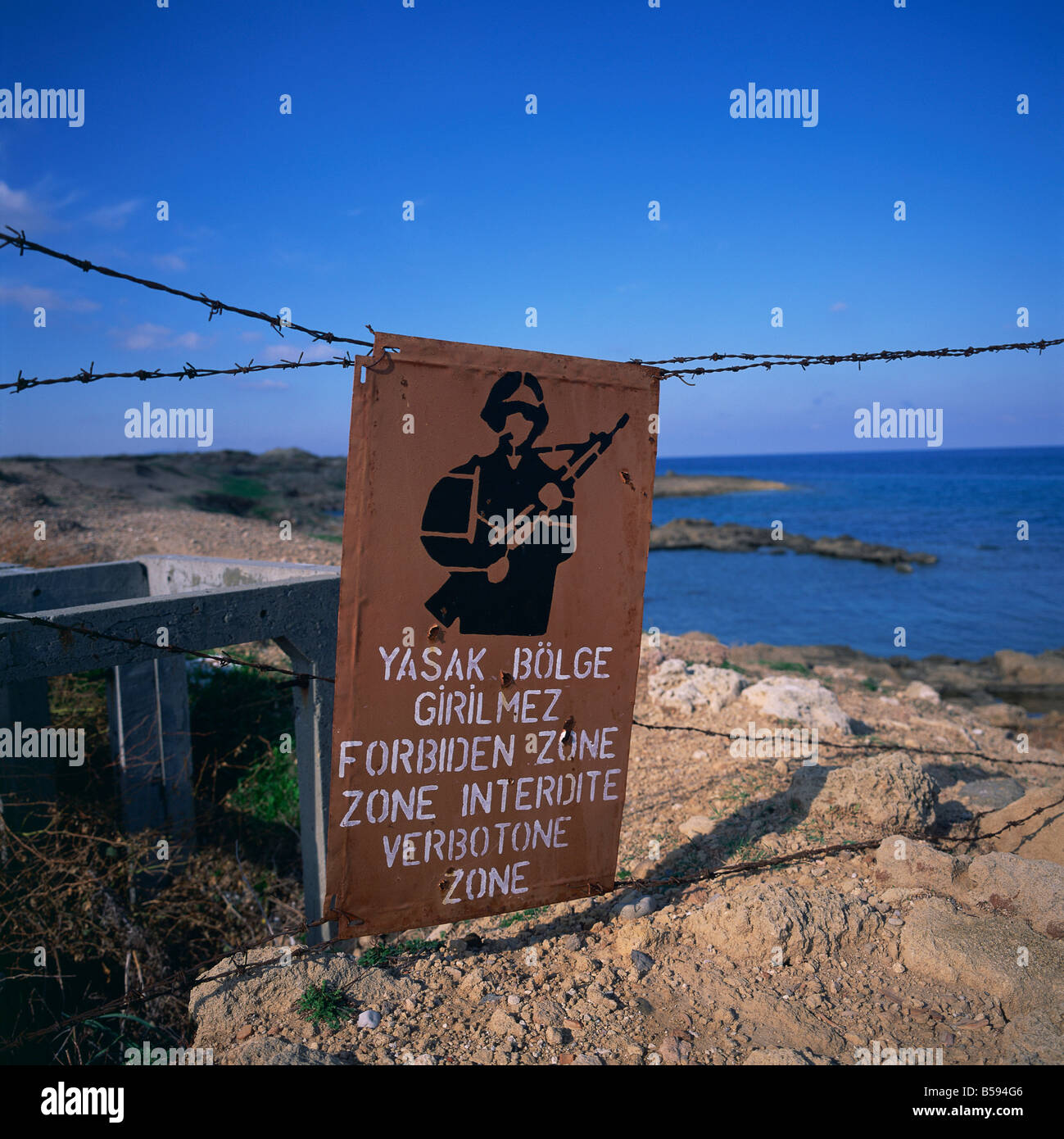 Barbed wire and forbidden zone sign of Turkish Military zone common ...