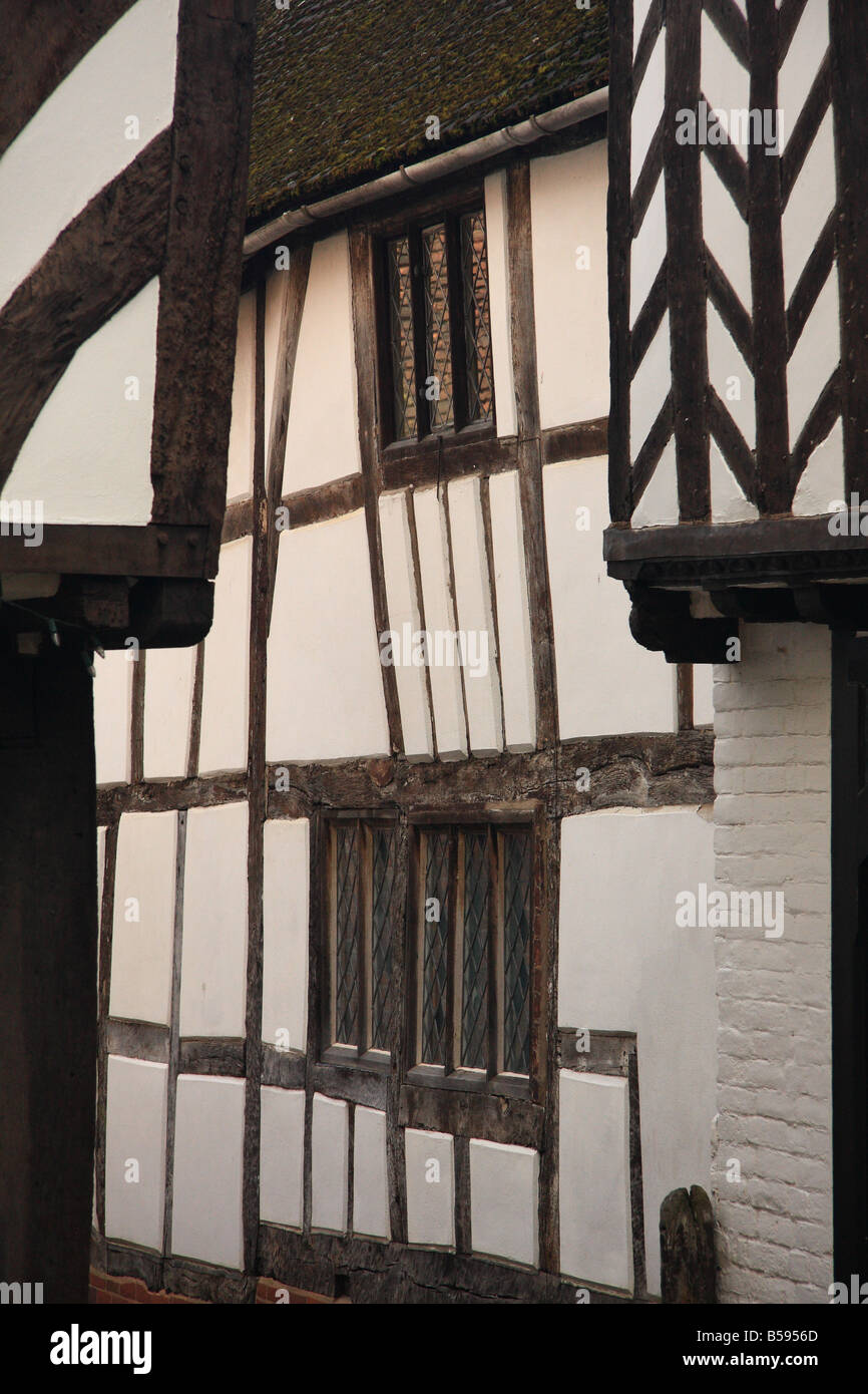 Tudor black and white wooden beamed cottage on a narrow street in ...