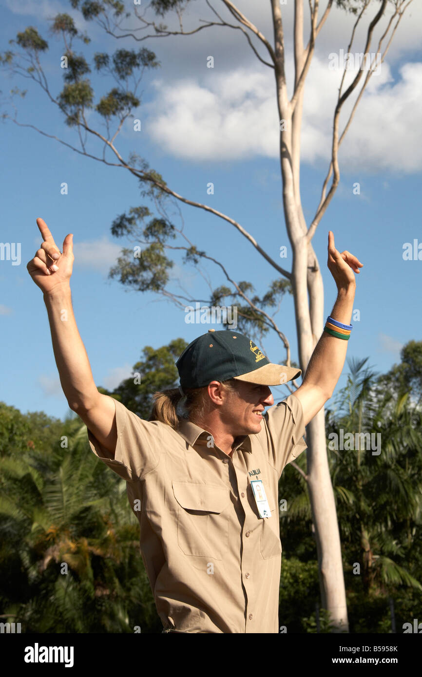 Male man keeper outside with arms raised in Australia Zoo wildlife and ...