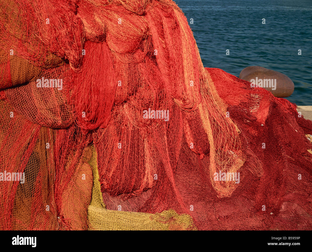 Pile of red fishing nets at Port Vendres in Languedoc Roussillon France ...