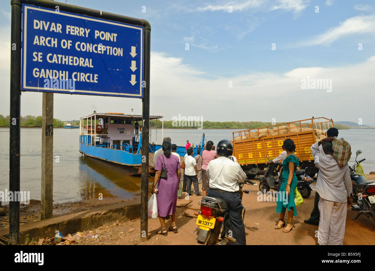 India, Goa, Old Goa. Local people boarding a ferry in the harbour on ...