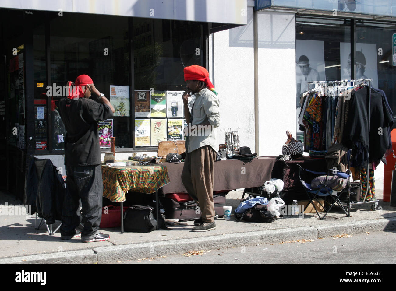 street vendor selling his merchandise Stock Photo - Alamy