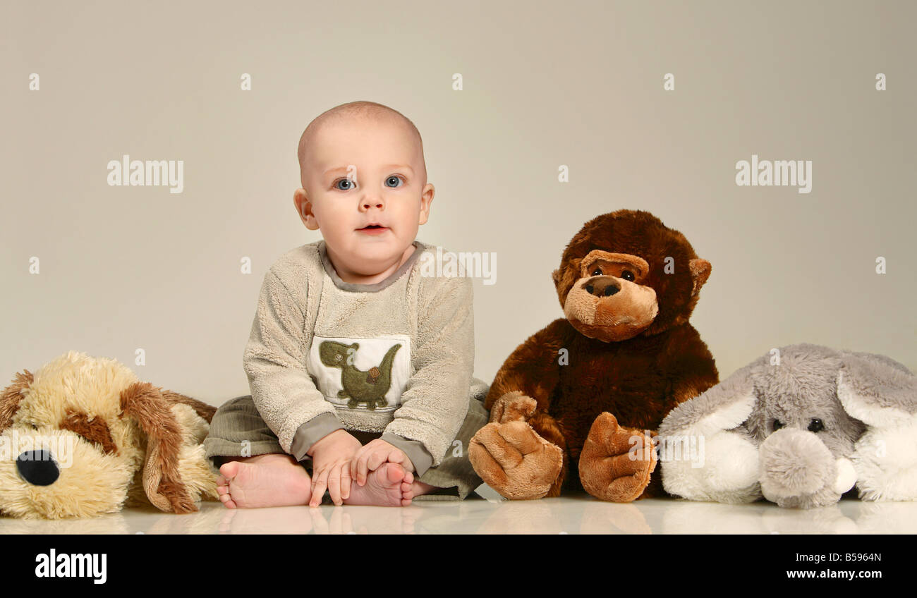 Little boy with stuffed animals Stock Photo - Alamy