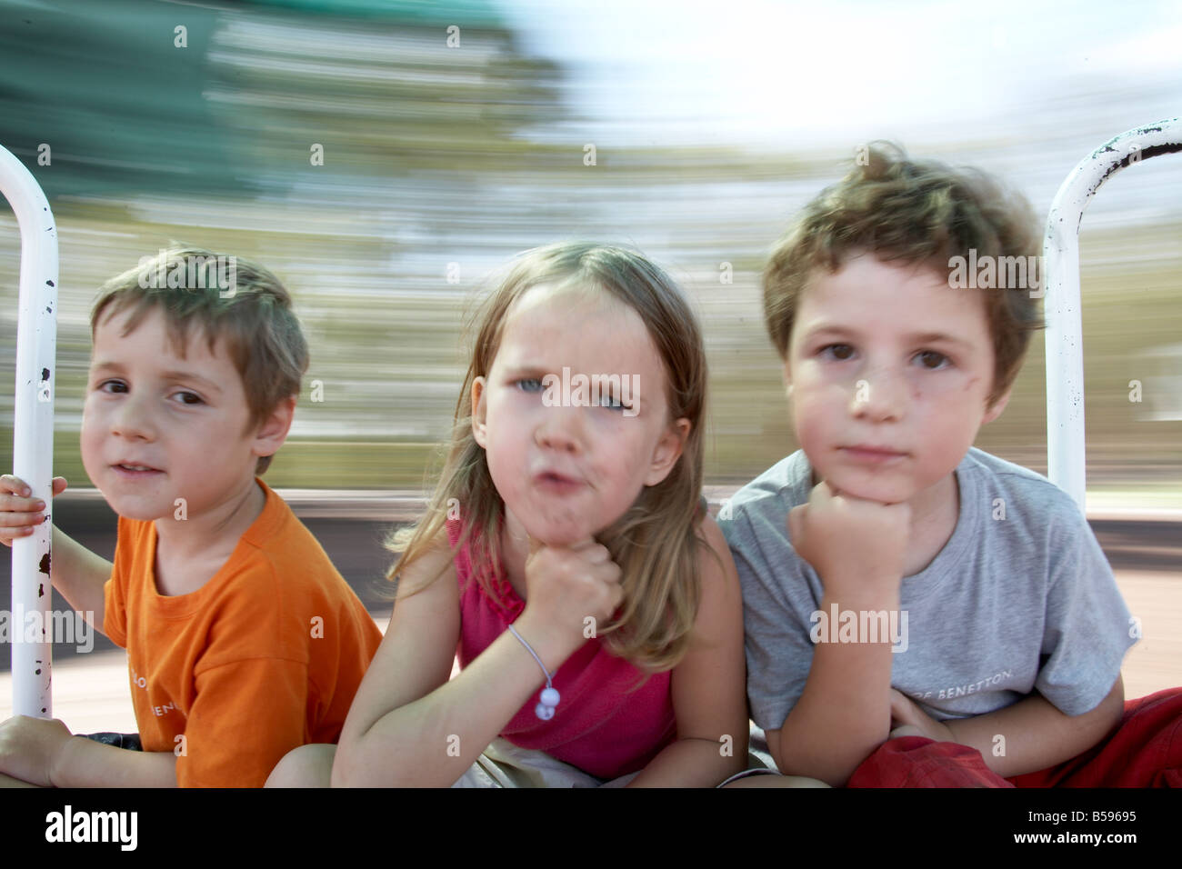 Children playing playground faces hi-res stock photography and images ...