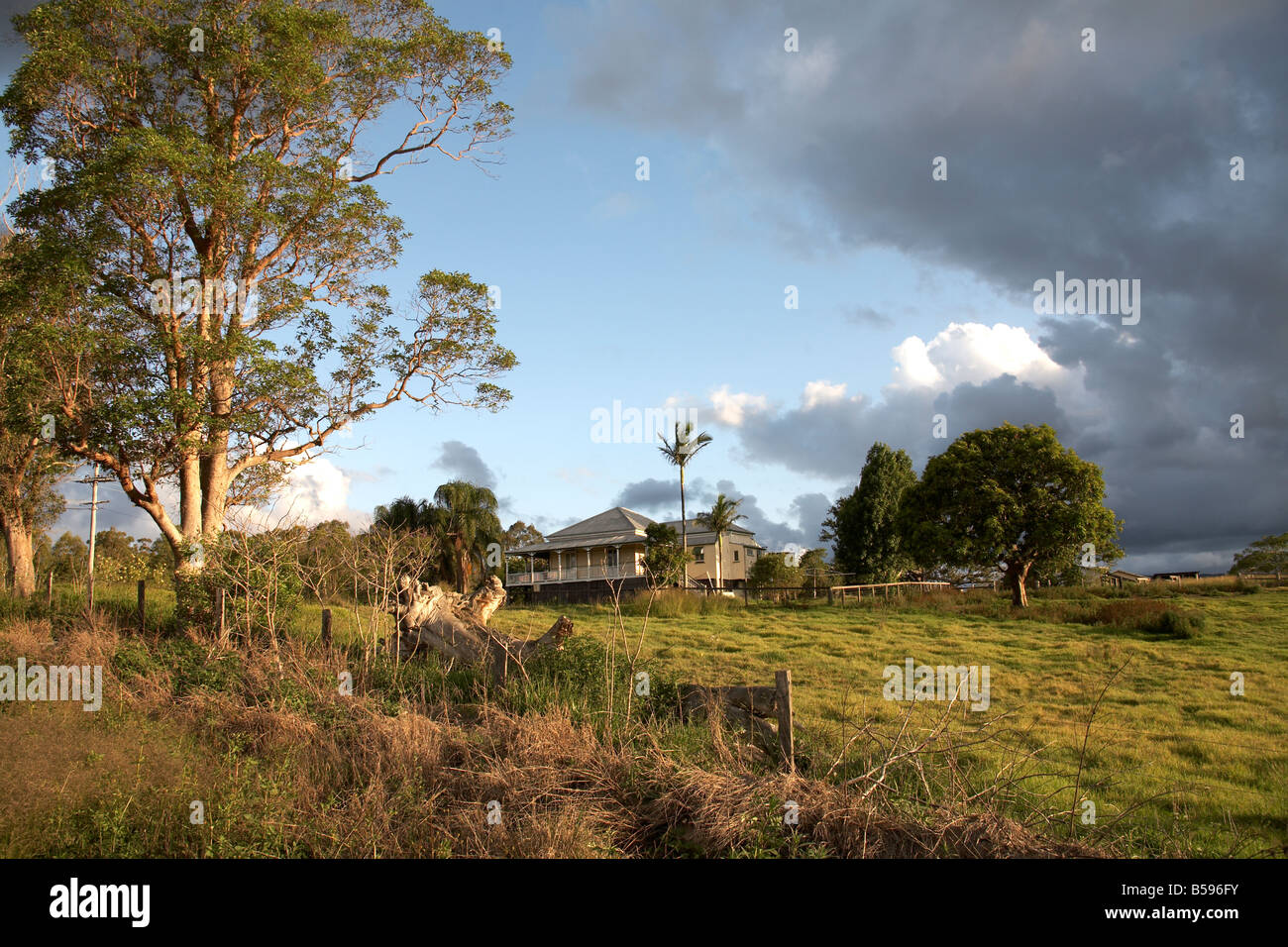 House and verandah in beautiful scenic landscape with green fields and ...