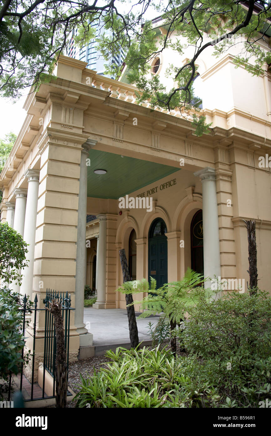 side view old victorian colonial house highrise city building cars in ...