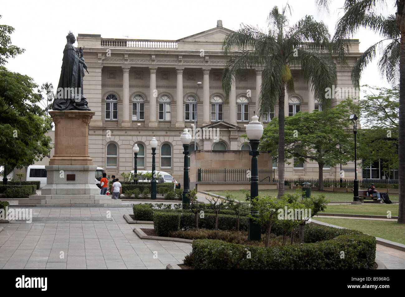 old victorian colonial house city building statue palms in Brisbane ...