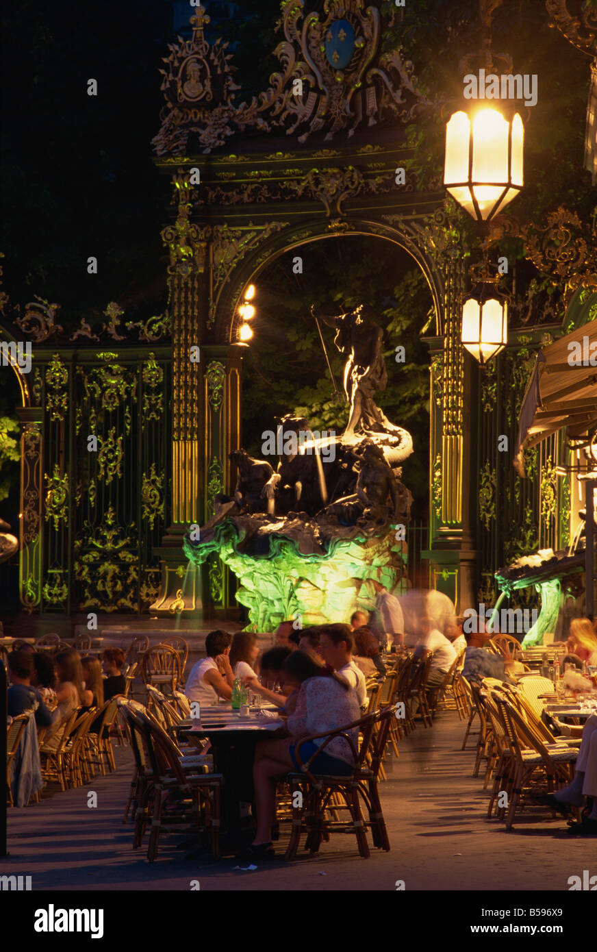 Pavement cafe at night in the Place Stanislas in Nancy, UNESCO World ...