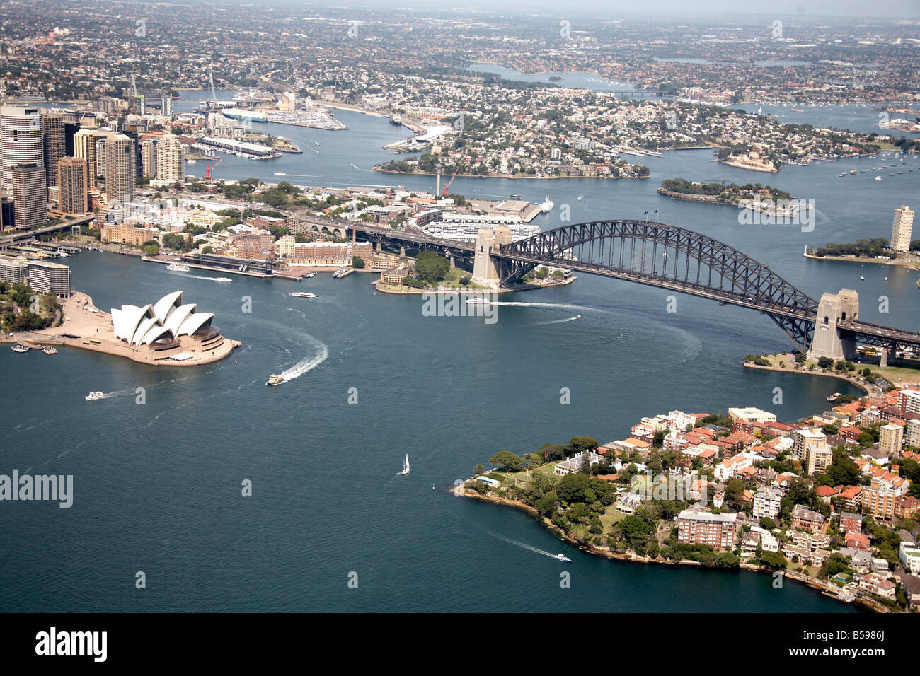 Aerial view west of Harbour Bridge Opera House tower blocks Neutral Bay ...