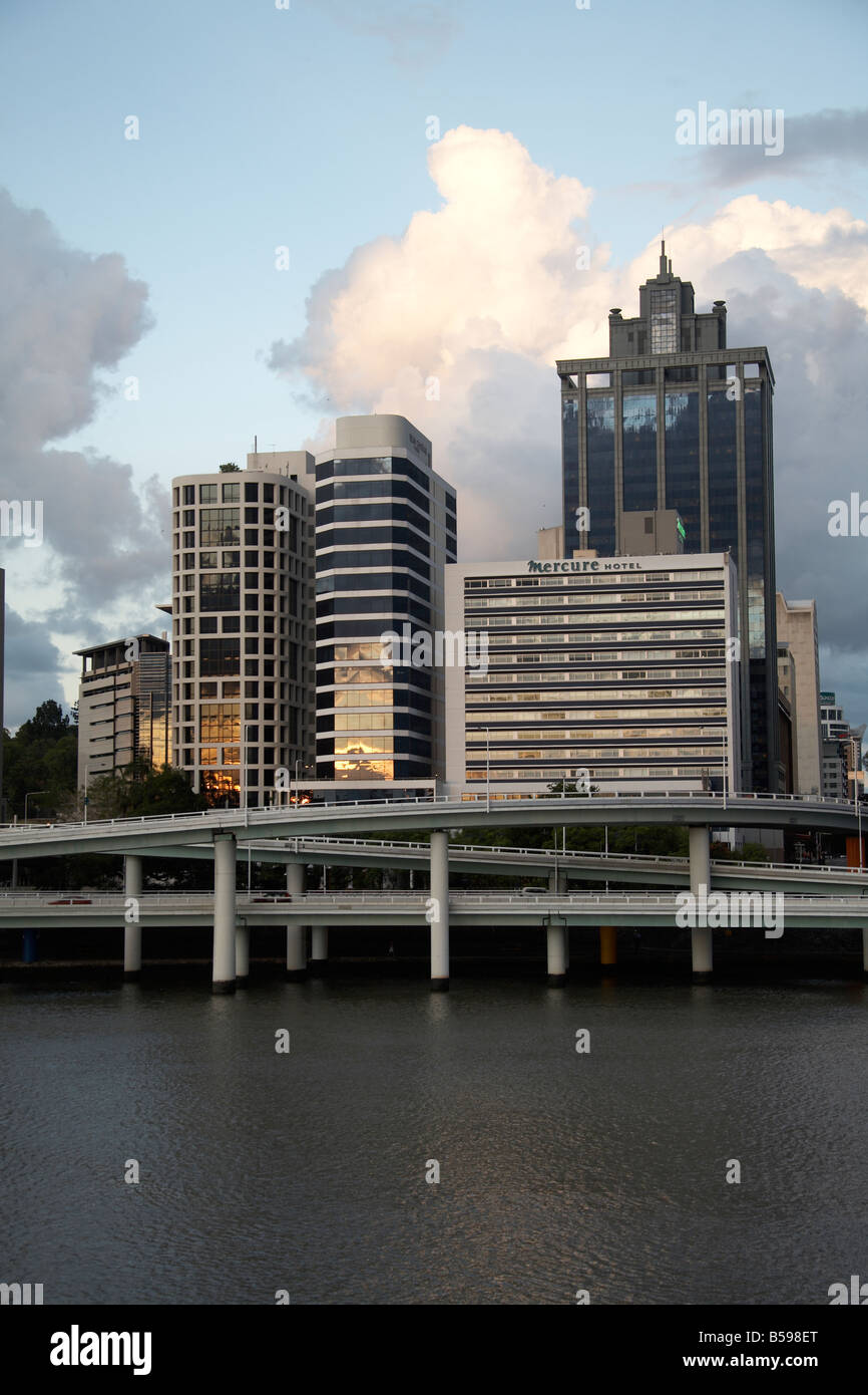 City centre business district waterfront buildings skyline beyond river ...