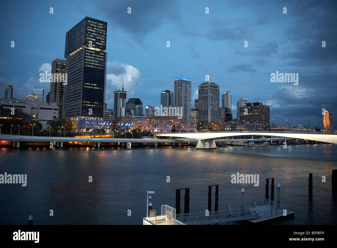 City centre business district waterfront buildings skyline beyond river ...