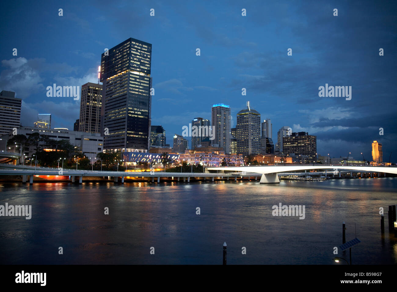 City centre business district waterfront buildings skyline beyond river ...