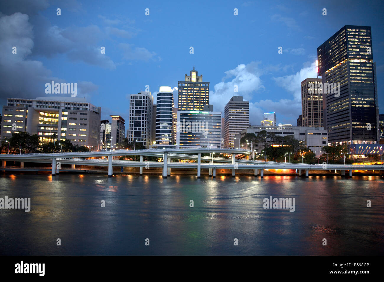 City centre business district waterfront buildings skyline beyond river ...