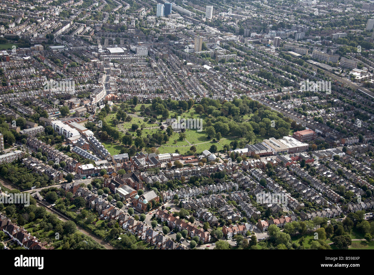 Aerial view north east of Willesden Lane Cemetery suburban houses tower ...