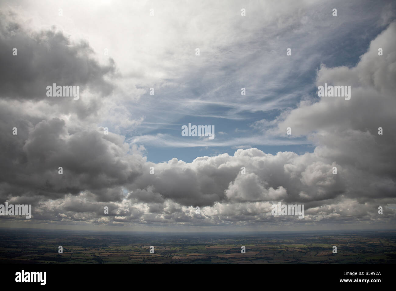 Aerial view south east of clouds against blue sky over country fields ...