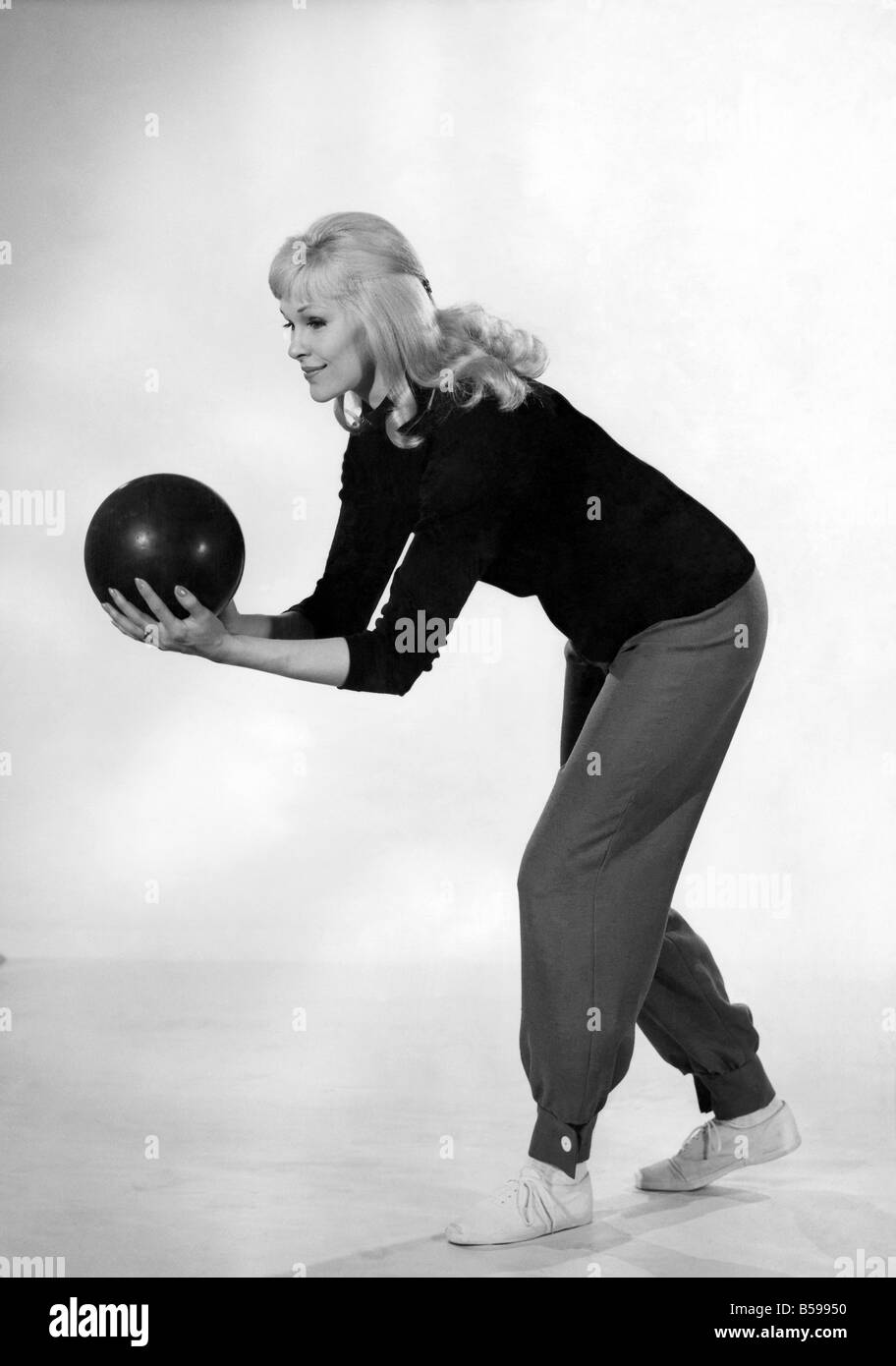 Reveille Fashions 1964: Jo Waring wearing a bowling suit of slacks and ...