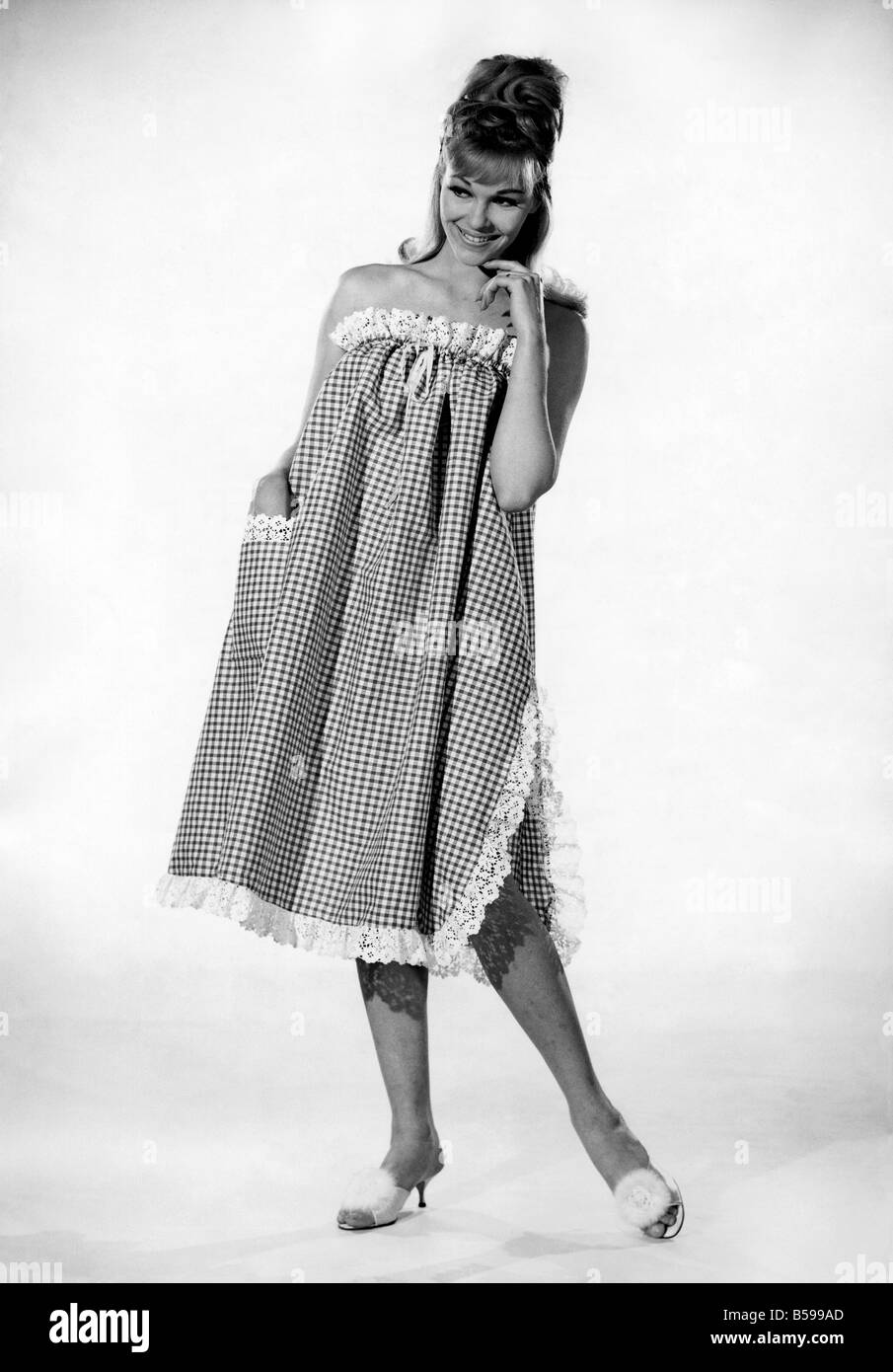 Reveille Fashions: Jo Waring. wearing a three quarters length night ...