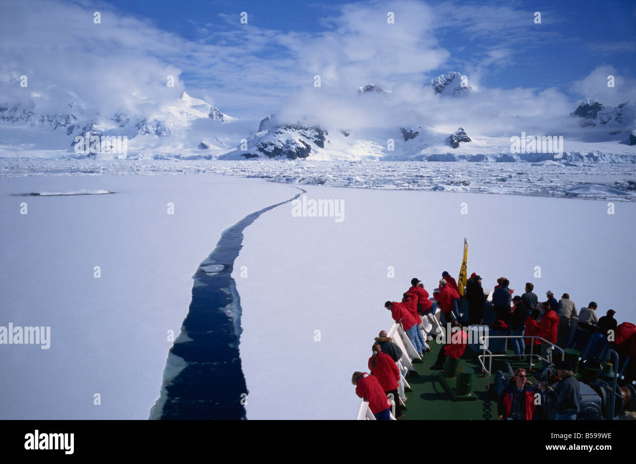 Tourist ship breaking through pack ice Antarctic Peninsula Polar ...