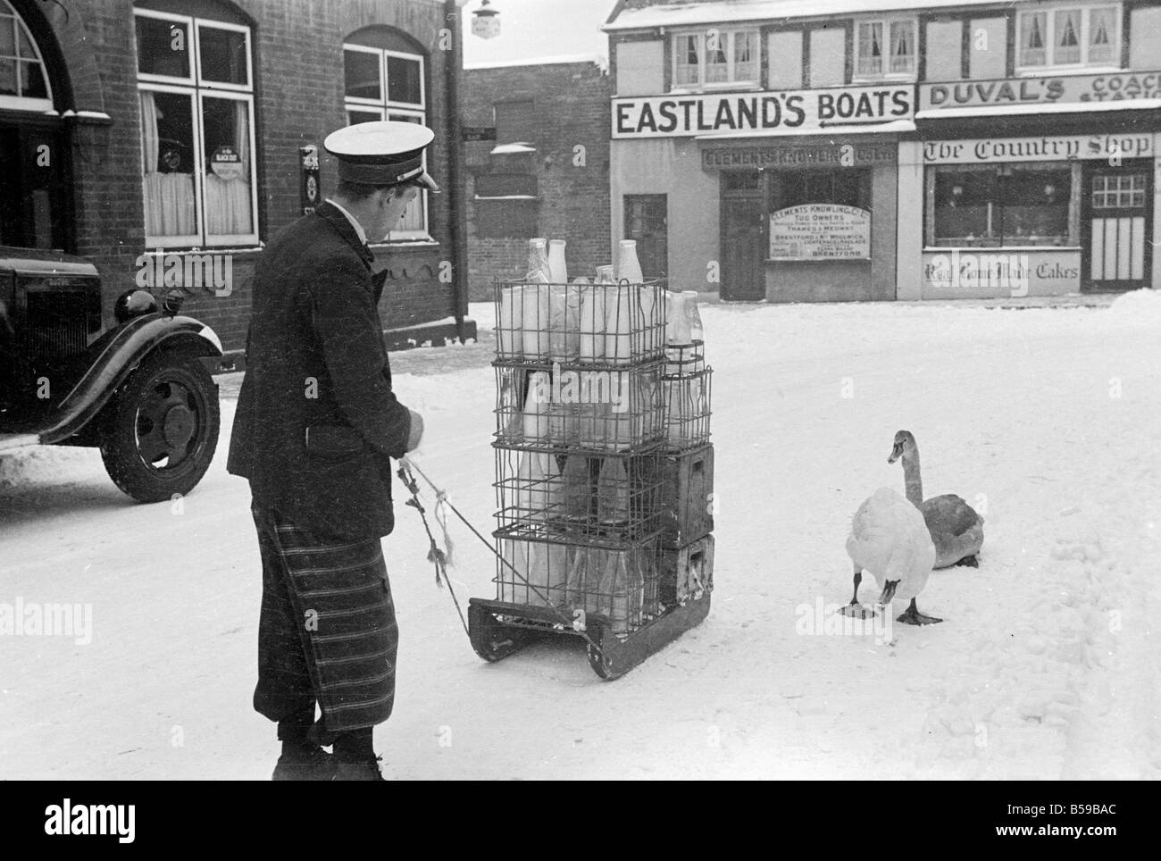 The heavy fall of snow overnight sees the milkman delivering his milk ...
