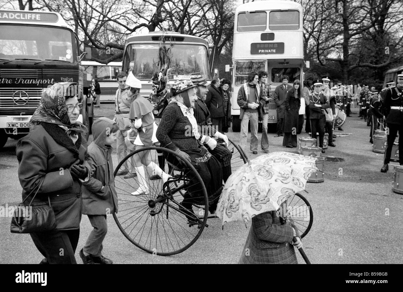 A couple ride their victorian tandam tricycle in the Easter parade ...