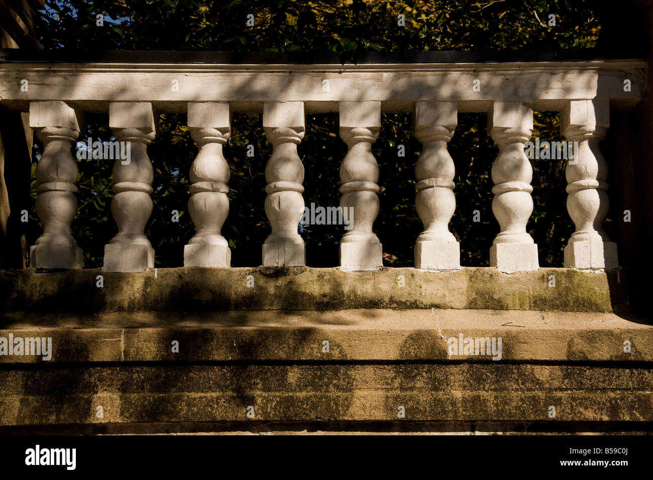 A hand turned wooden railing fronts a house on Meeting Street in ...