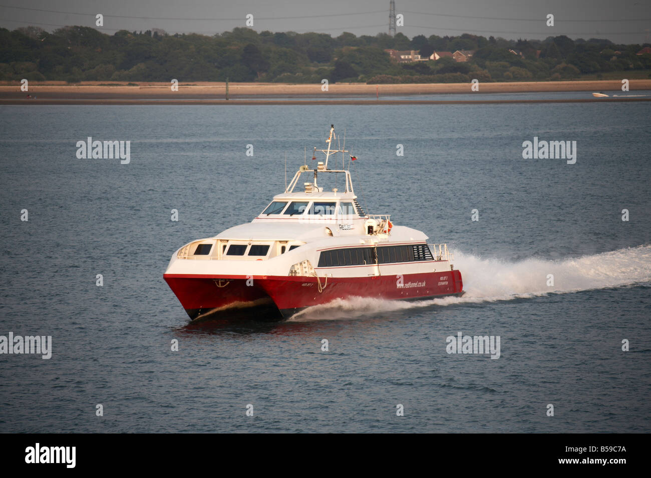 Red Funnel passenger ferry catamaran sailing on on Southampton Water in ...