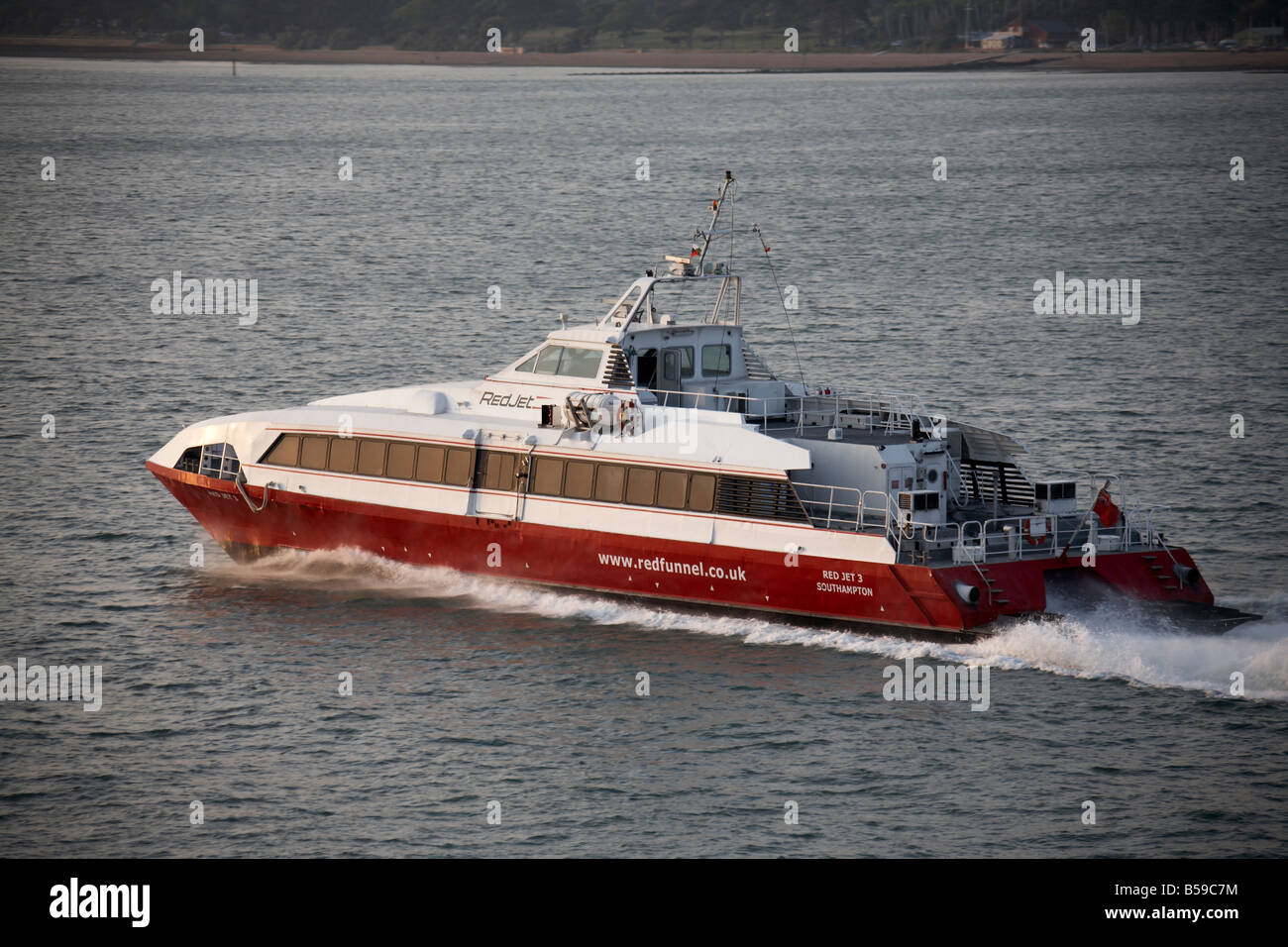 Red Funnel passenger ferry catamaran sailing on on Southampton Water in ...