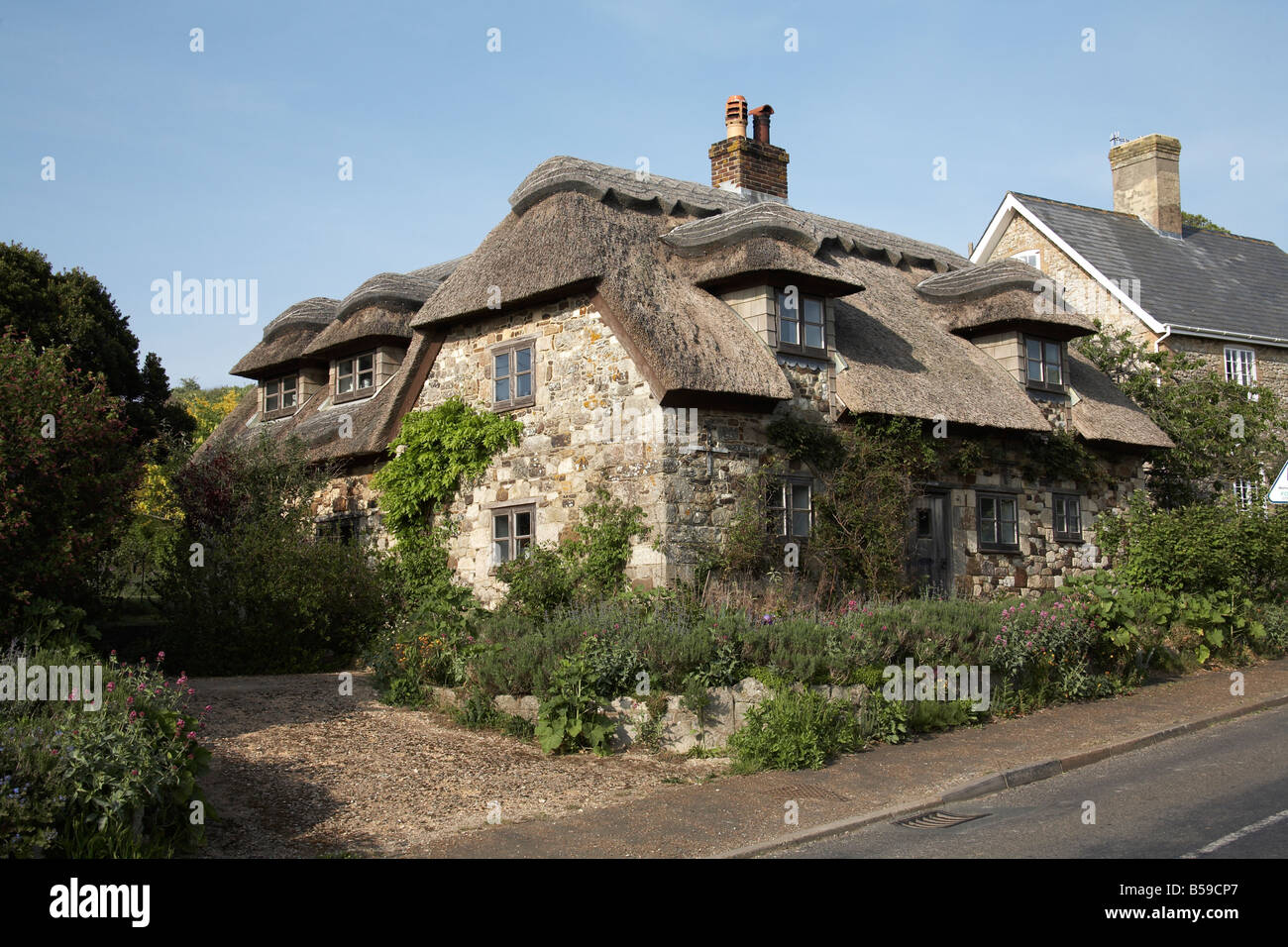 Old stone house with thatched roof in Mottistone village Isle of Wight ...
