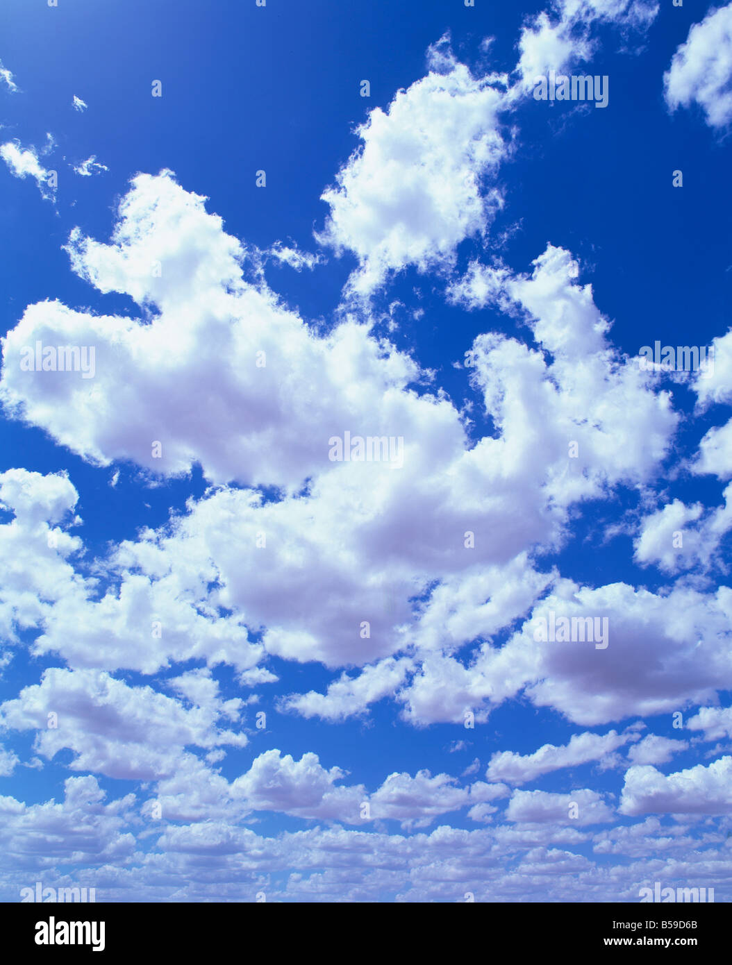 Puffy white cumulus clouds in blue skies over Regans Ford Western ...