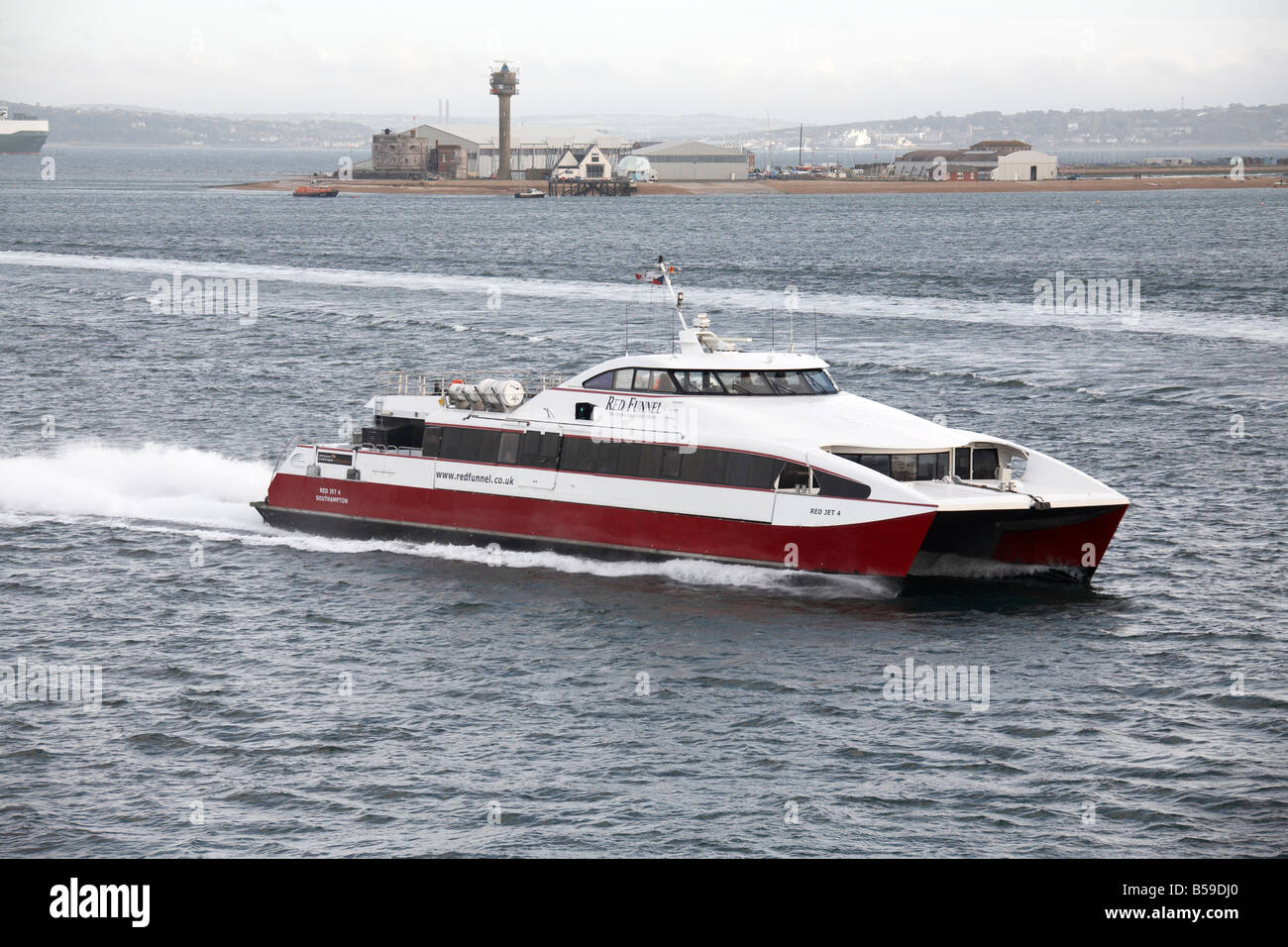 Red Funnel catamaran with Calshot fort and maritime control tower on ...